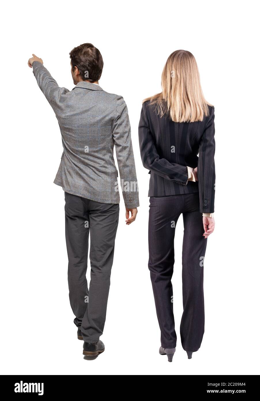 Back view of business man and business woman in suit pointing. Business ...