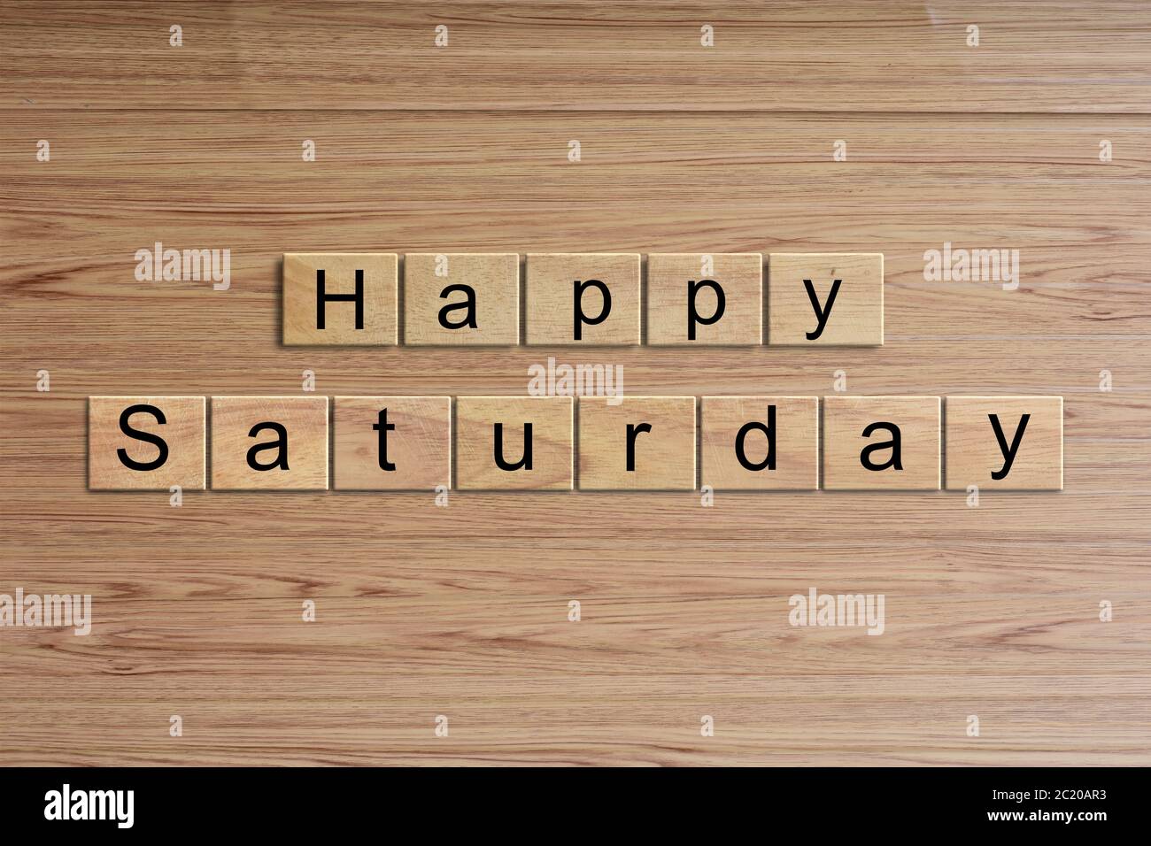 Happy Saturday word written on wood block. Message text on wooden table ...