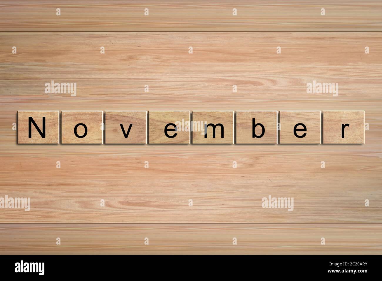 November word written on wood block. Message text on wooden table for ...