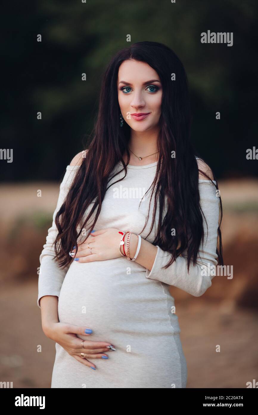 Future mother walking in the park and relaxing Stock Photo - Alamy