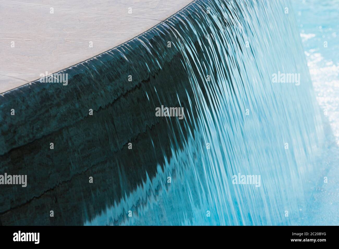 Detail view of a swimming pool waterfall Stock Photo - Alamy
