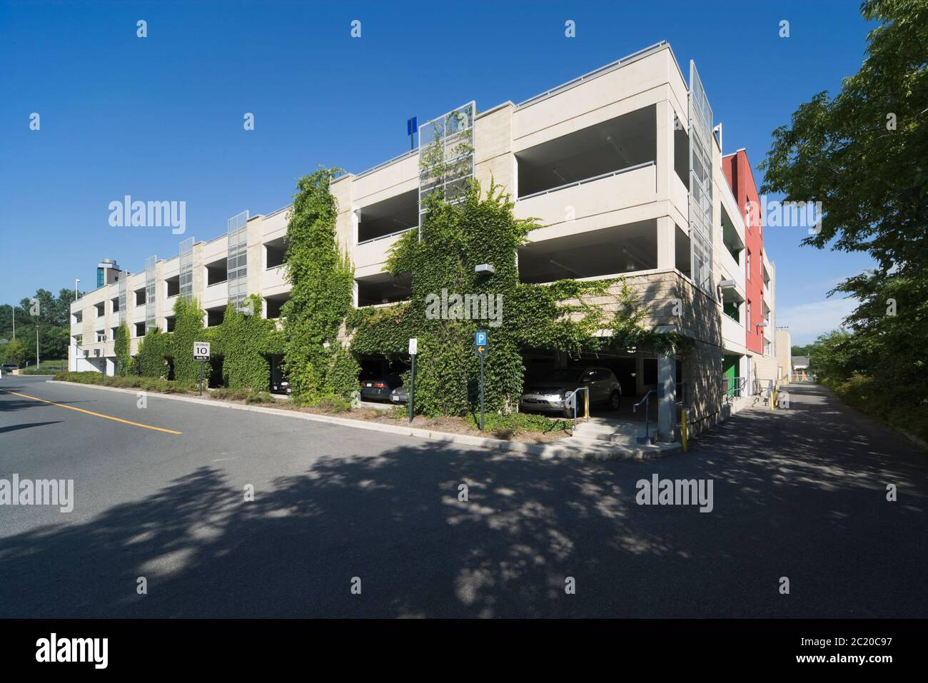 Modern parking garage with greenery growing up the front Stock Photo ...