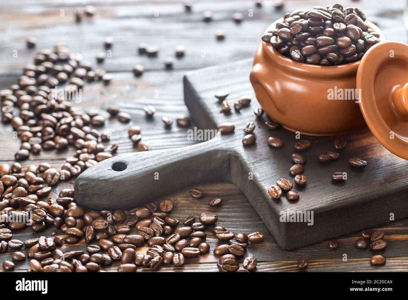Rustic pot of coffee beans Stock Photo - Alamy