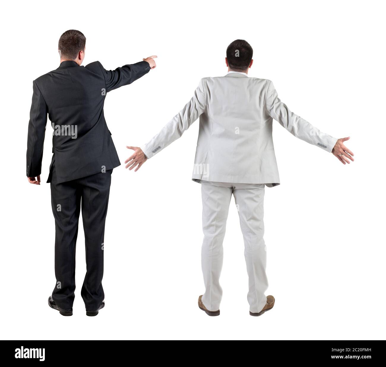 Back view of business man and business woman in suit pointing. Business ...