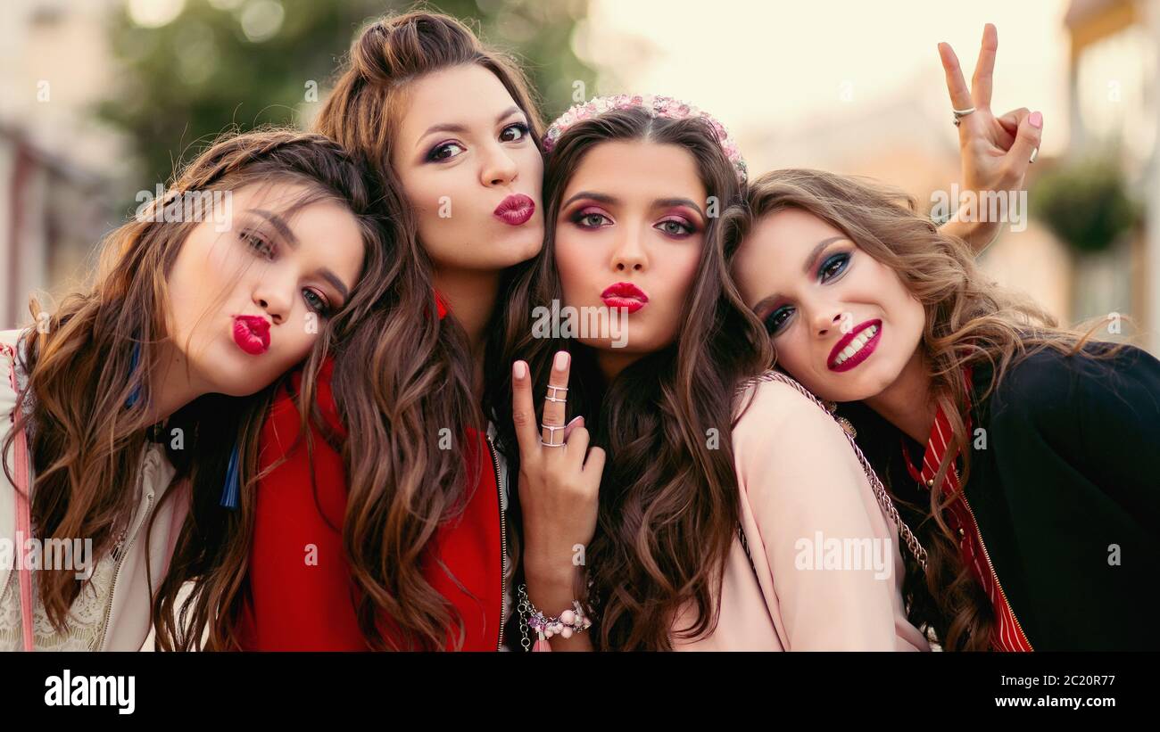 Group of gorgeous girlfriends smiling and gesturing at camera Stock ...