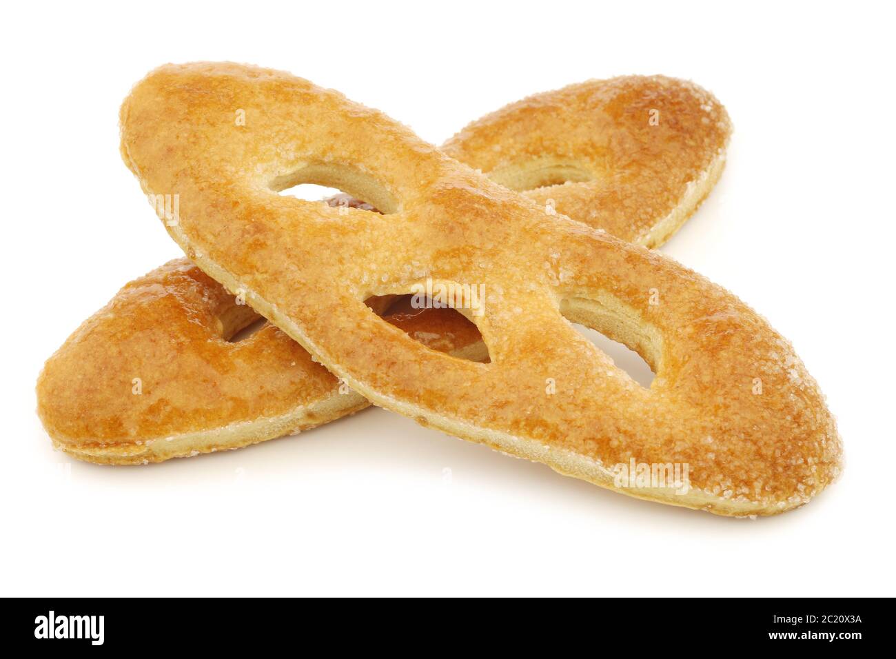 traditional sugar coated Dutch cookies called "krakeling" on a white ...