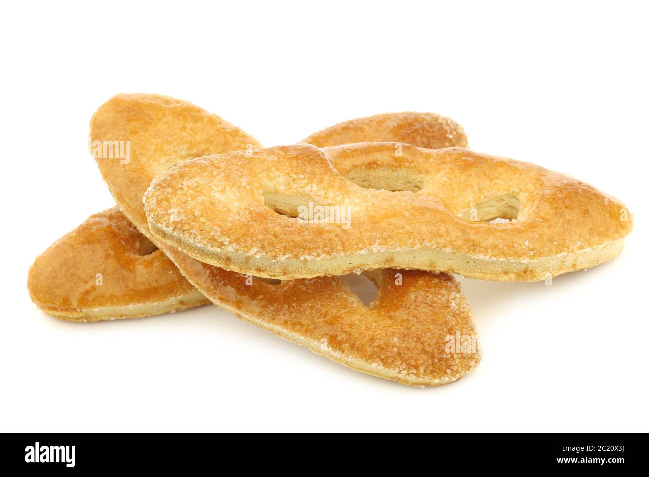 traditional sugar coated Dutch cookies called "krakeling" on a white ...