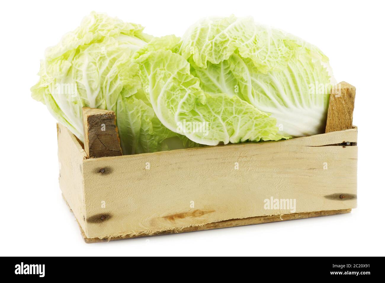 fresh chinese cabbage in a wooden crate on a white background Stock ...