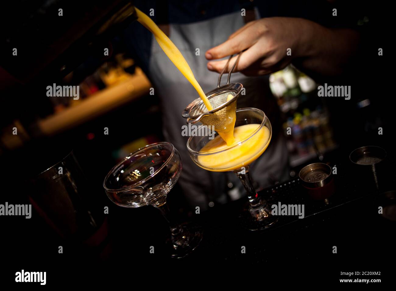 Bartender pouring cocktail hi-res stock photography and images - Alamy