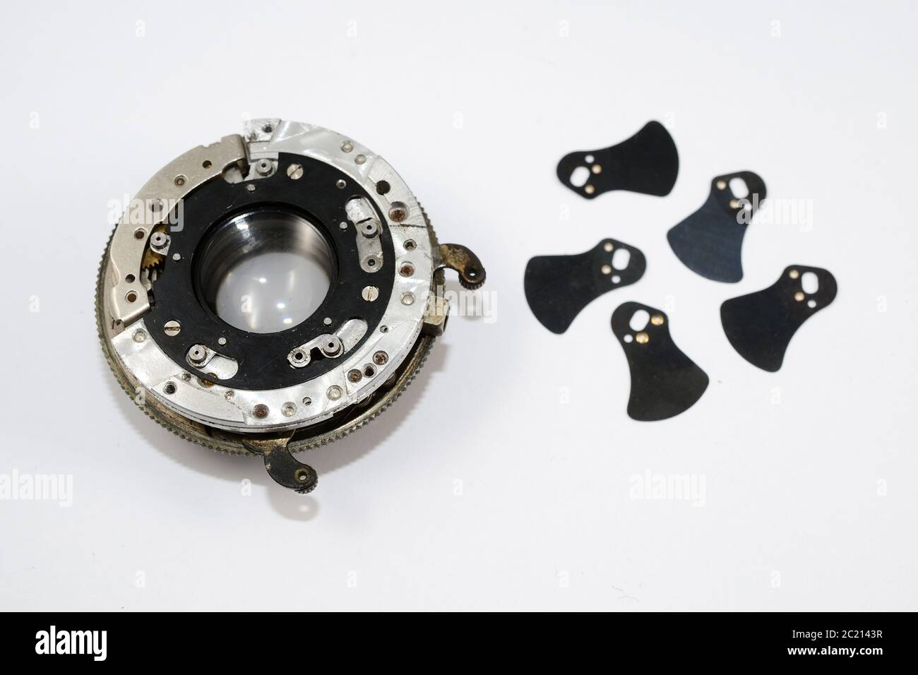 old vintage disassembled lens, aperture blades Stock Photo - Alamy