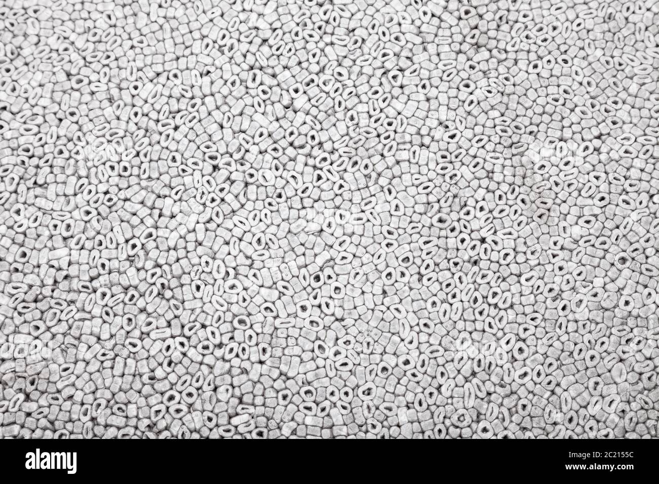 Gray foam texture made of cylindrical fibers. Background for transport ...