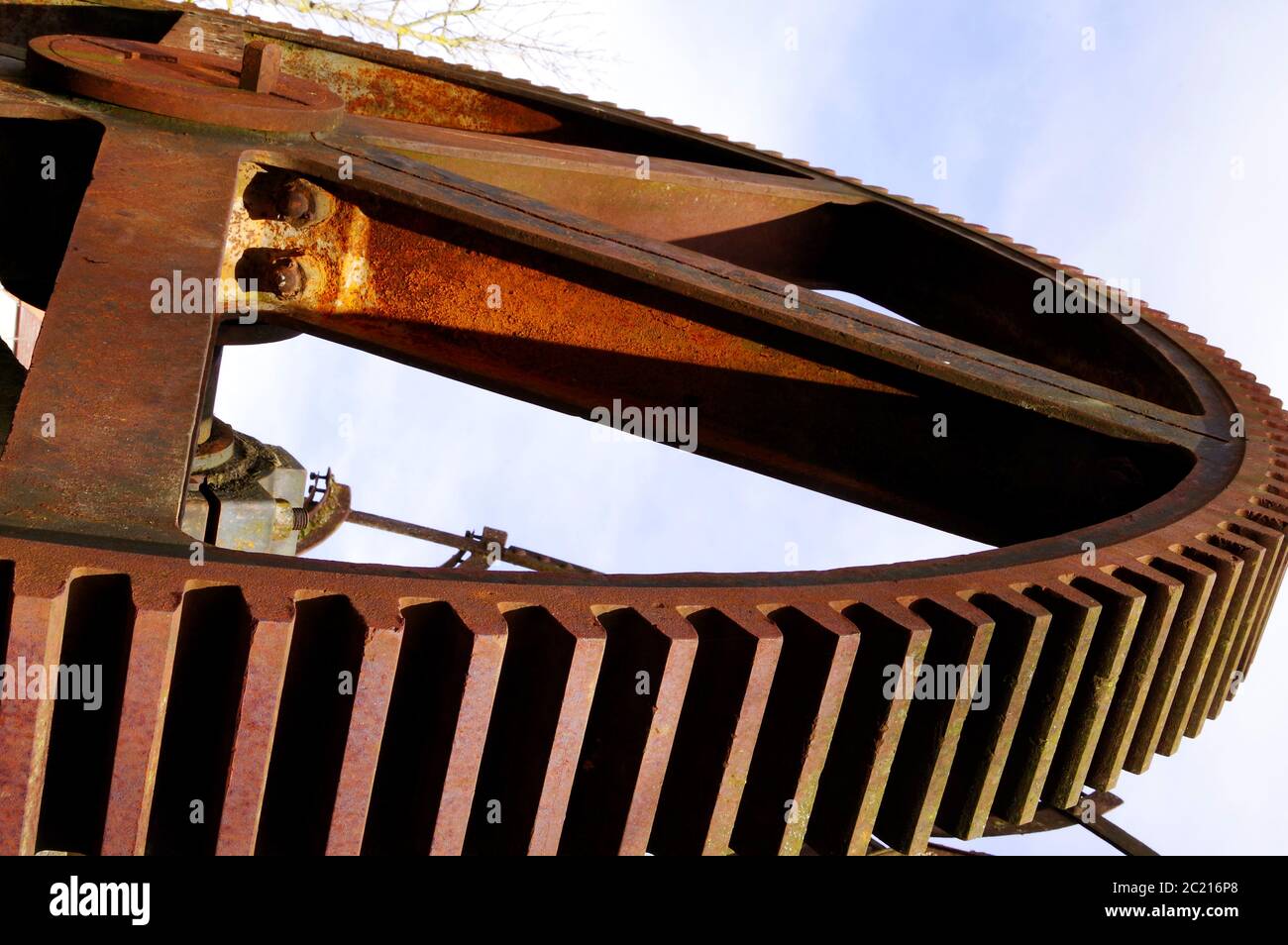 Big gear full of rust in steep perspective against blue sky Stock Photo ...