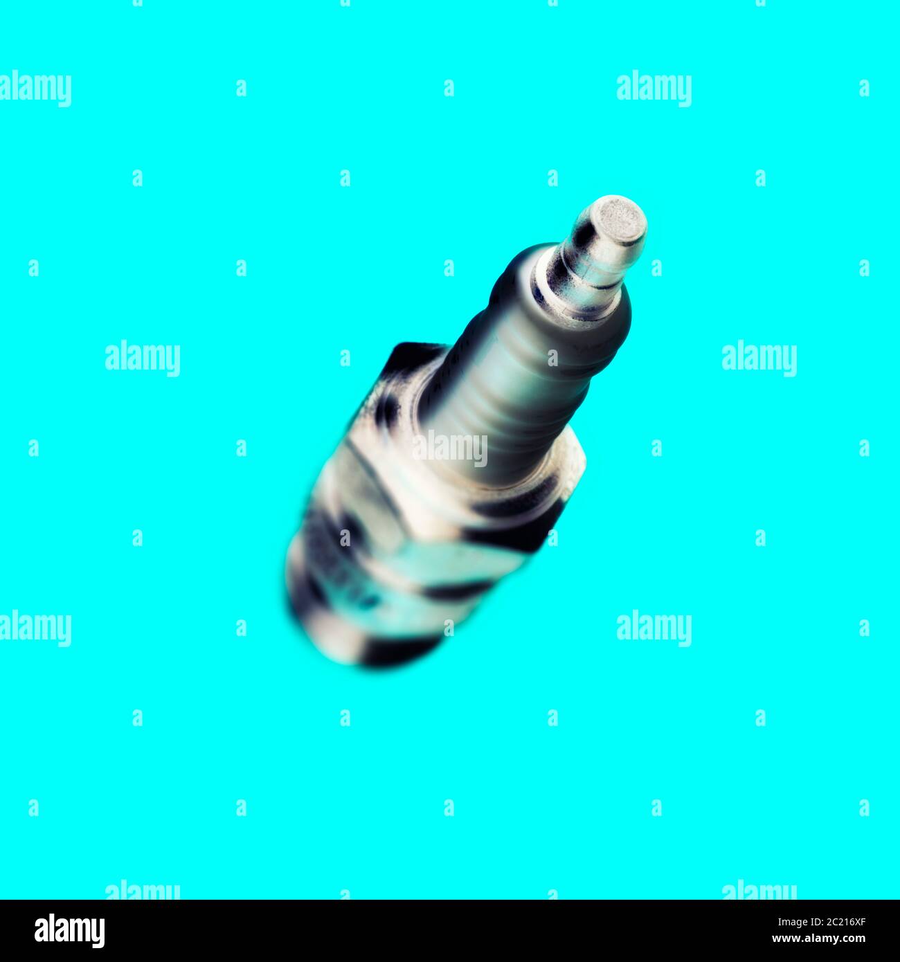 Abstract view looking down a spark plug with a shallow depth of field ...