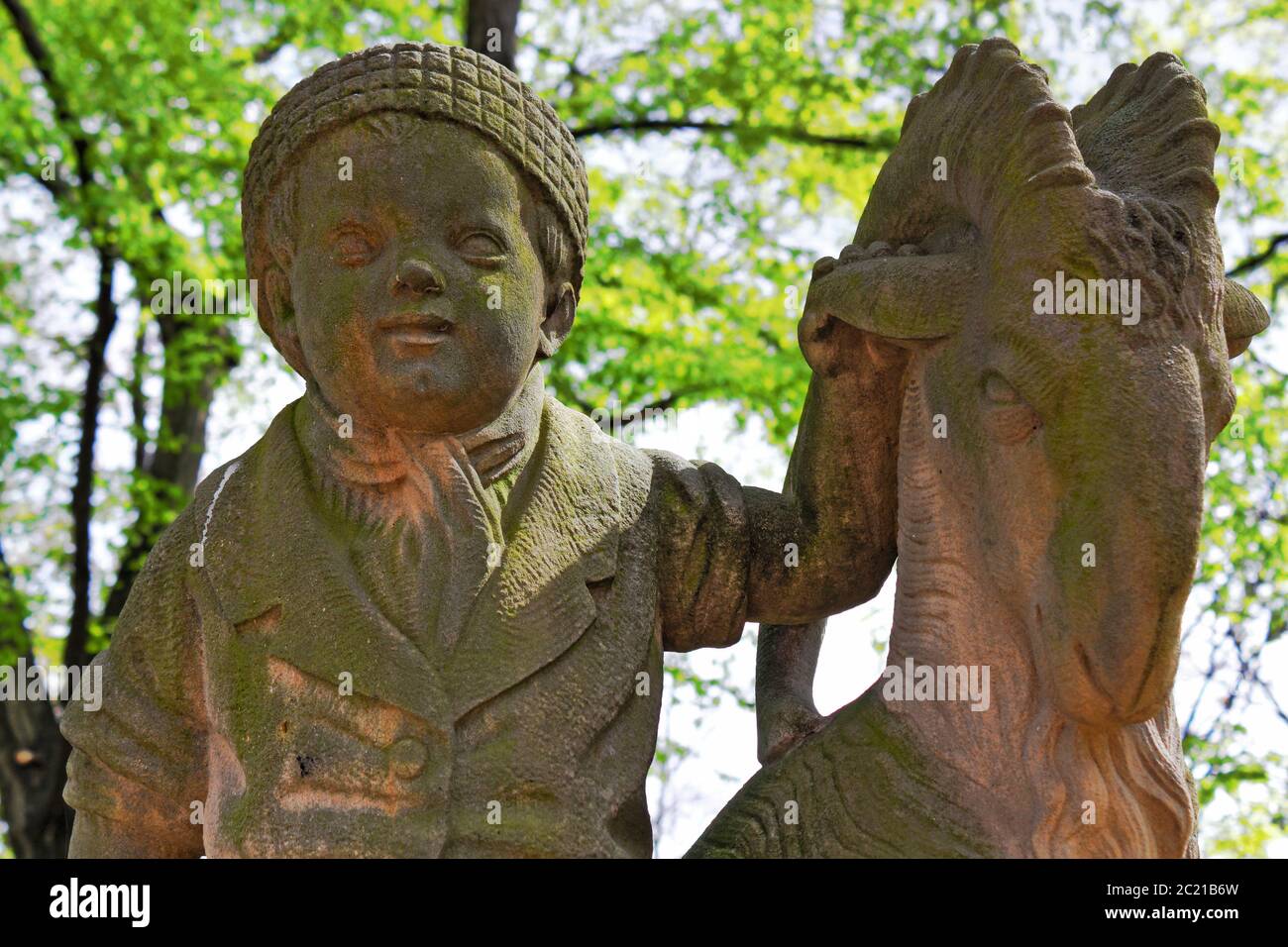 Boy with billy goat Stock Photo - Alamy