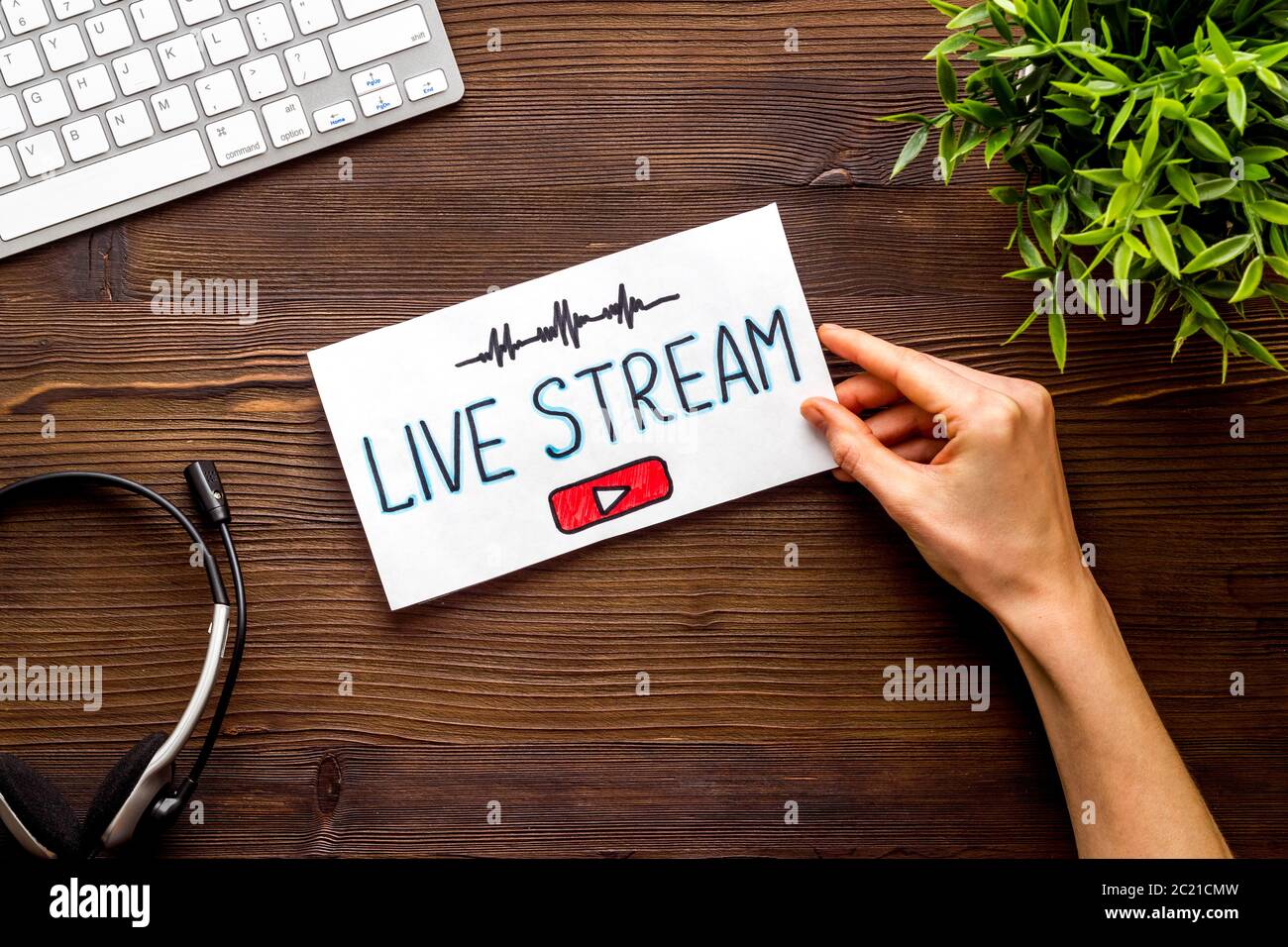 Live streaming web network concept. Female hands holding paper tablet ...