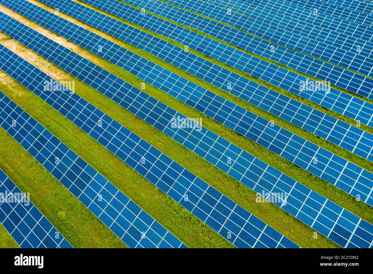 Solar cells in green field Stock Photo - Alamy