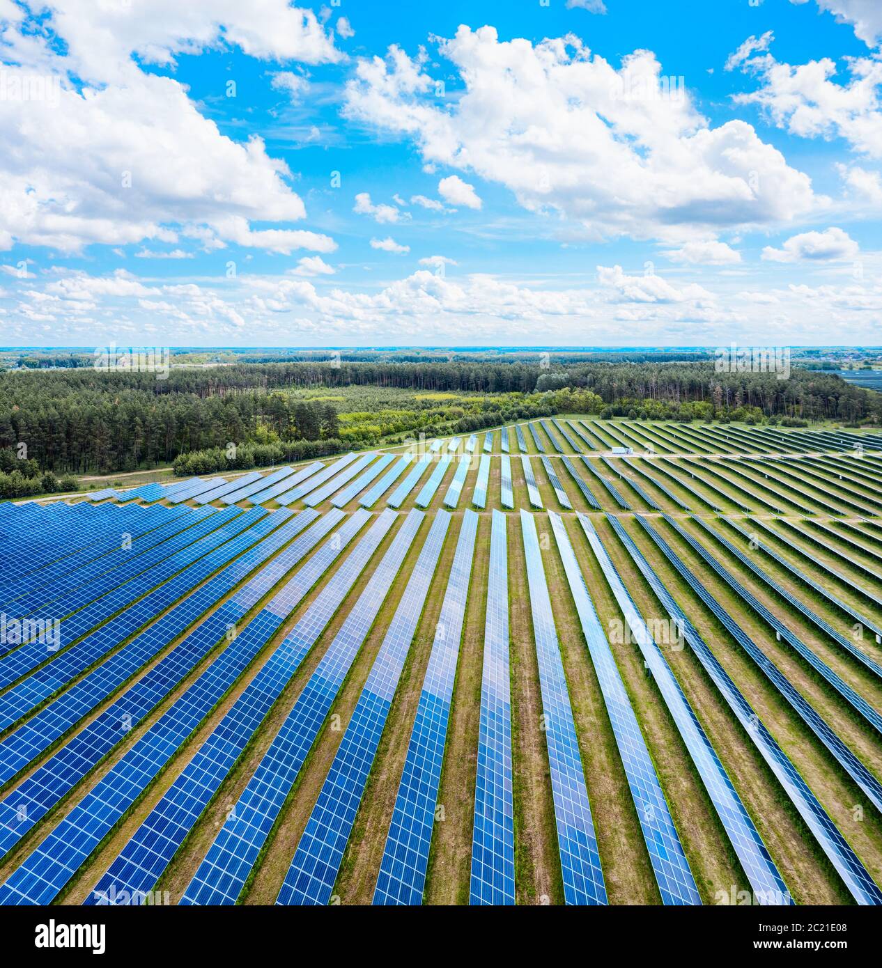 Solar panels in green field, renewable energy Stock Photo - Alamy