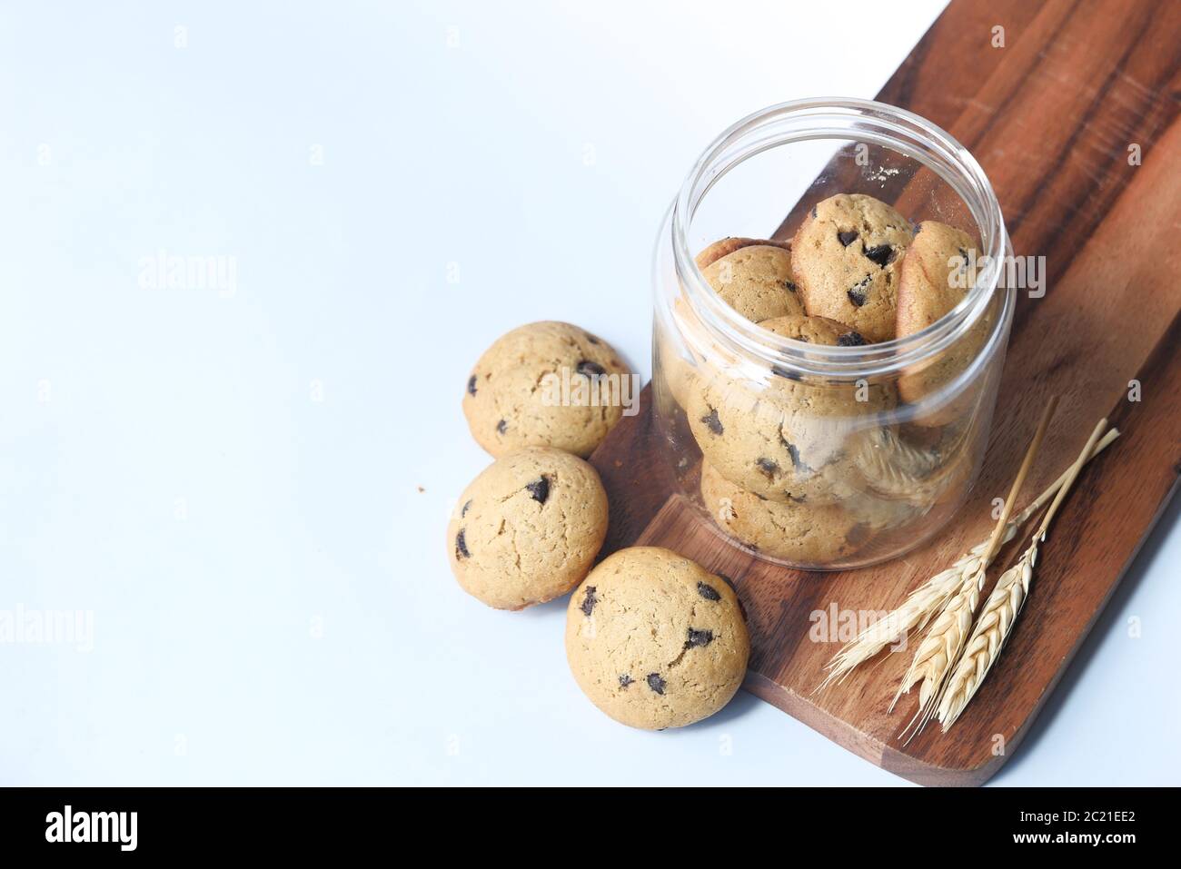 Jar full of chocolate chip cookies on white background Stock Photo - Alamy