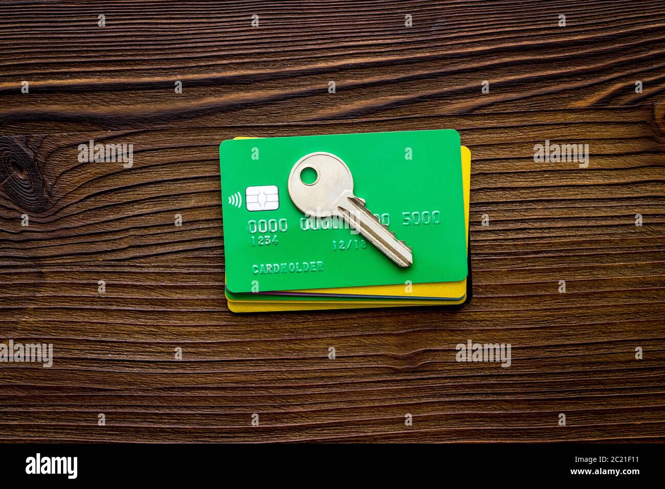 Credit card security concept with key on wooden desk top-down Stock ...