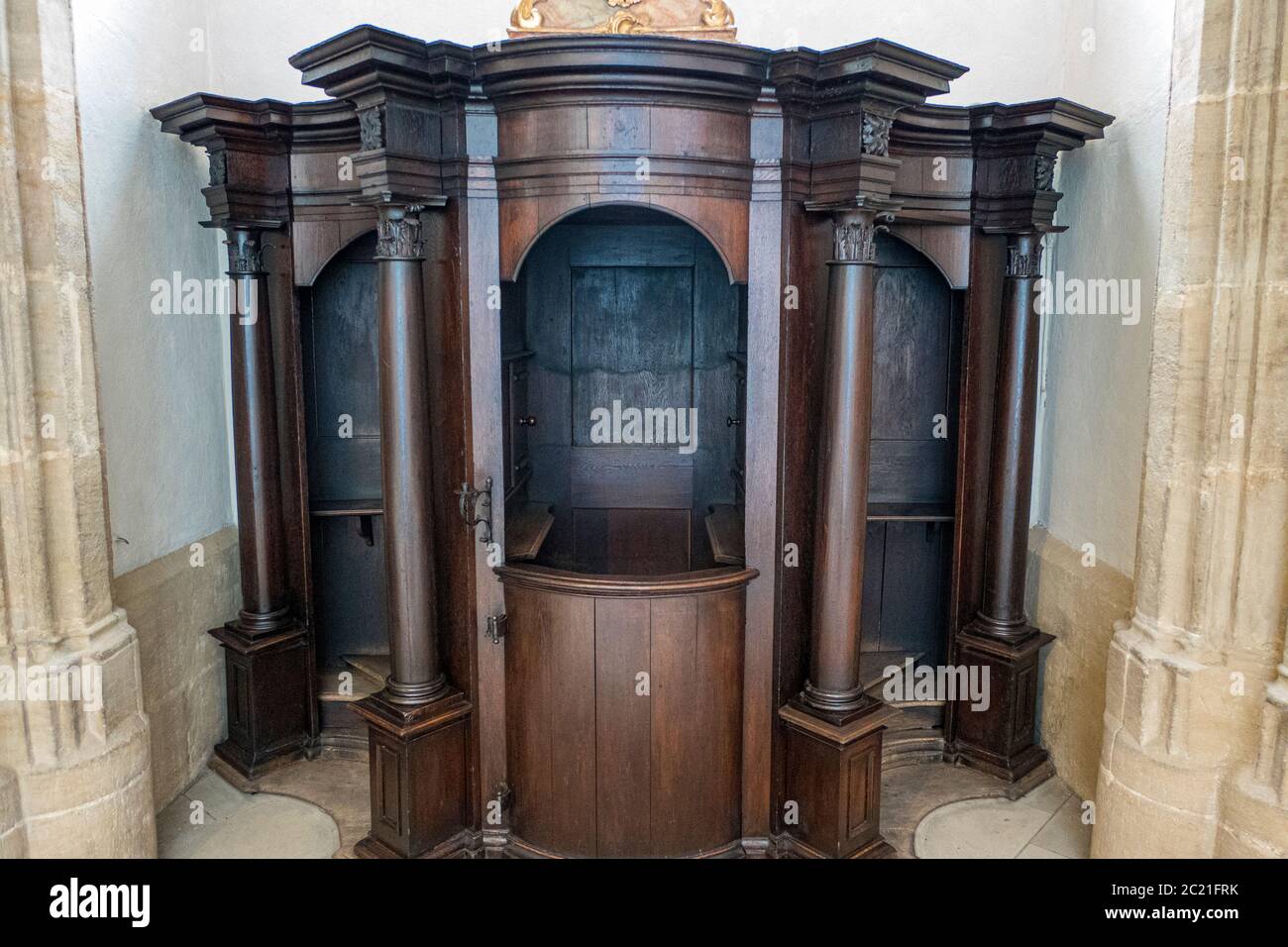 old wooden confessional chair empty in a church Stock Photo - Alamy