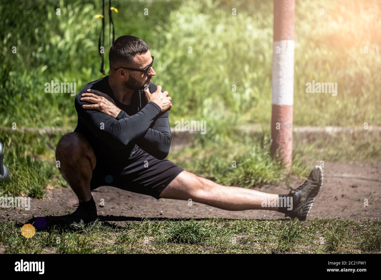 Young man is stretching before jogging. Fitness and lifestyle concept ...