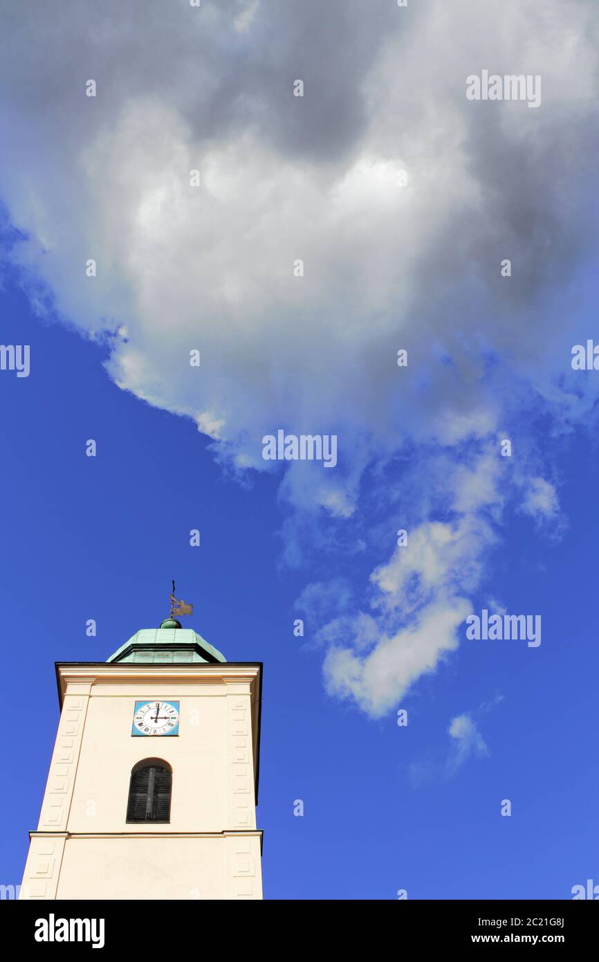 Cloud over church tower Stock Photo - Alamy