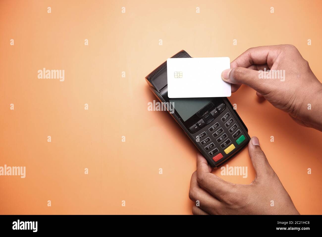 Payment terminal charging from a card, contactless payment Stock Photo ...