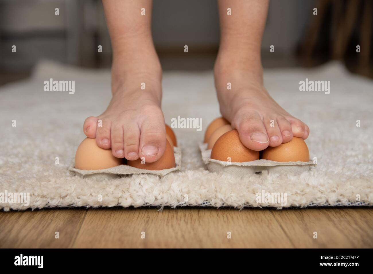Kid science experiments at home. Close-up child walking on eggs. Strong ...