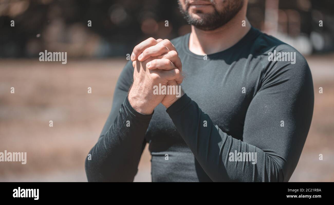 Man doing arm stretching exercises to warm up his muscles before ...