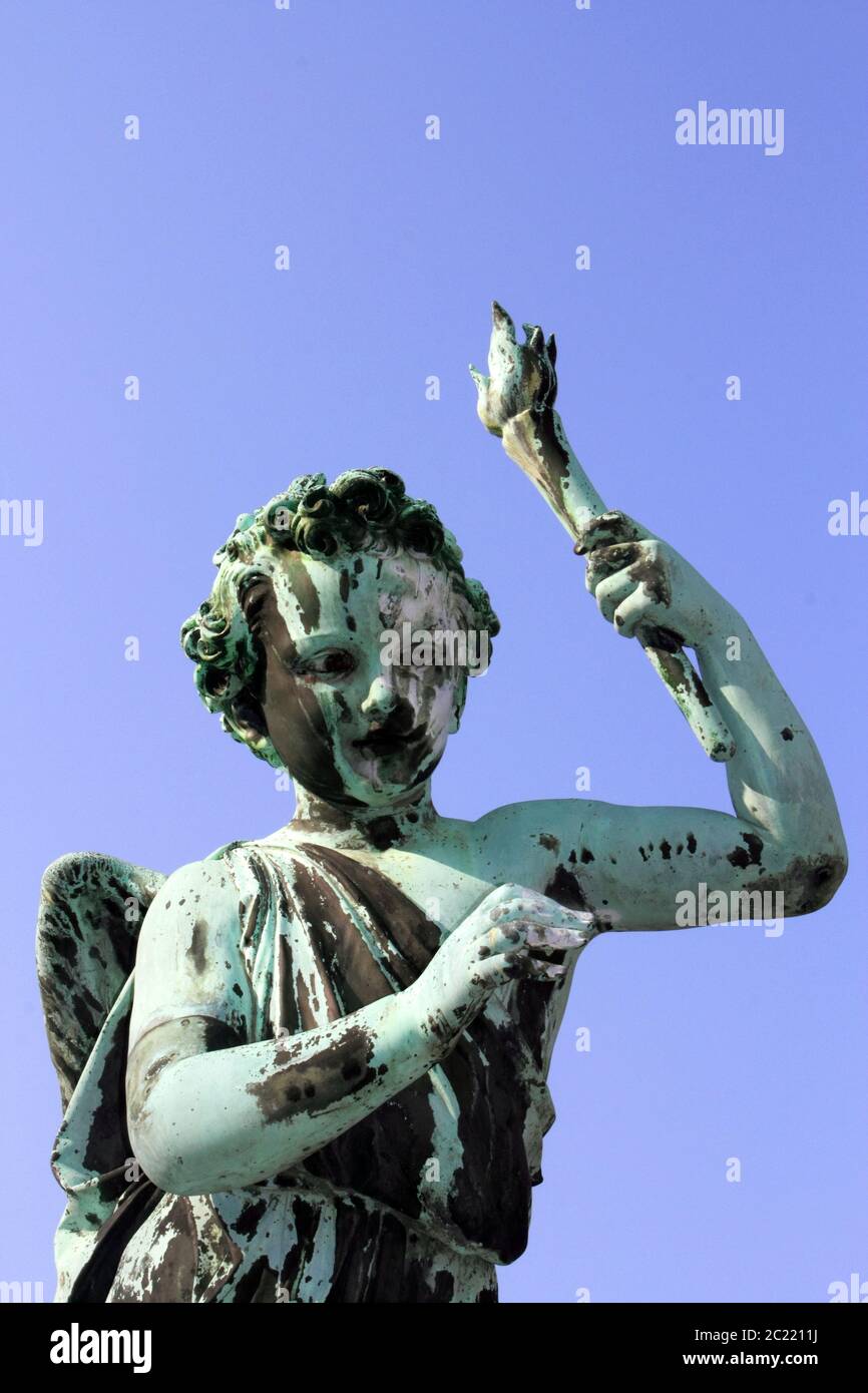 Angel with torch Stock Photo - Alamy