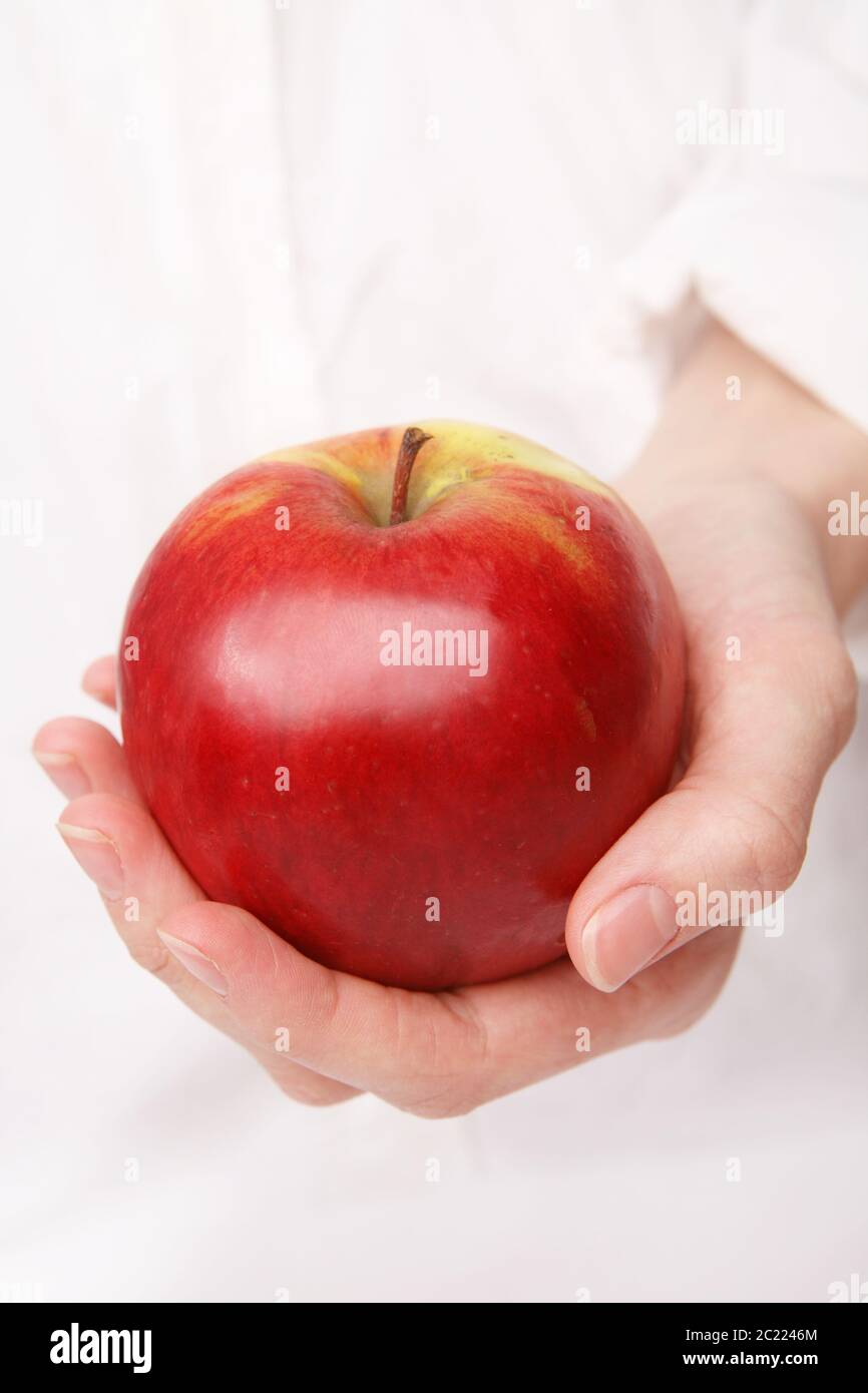 Red apple in hand. Healthy nutrition Stock Photo - Alamy