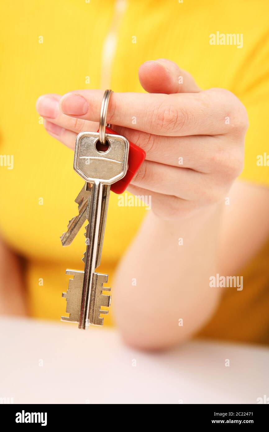 bunch of keys in woman's hand Stock Photo - Alamy