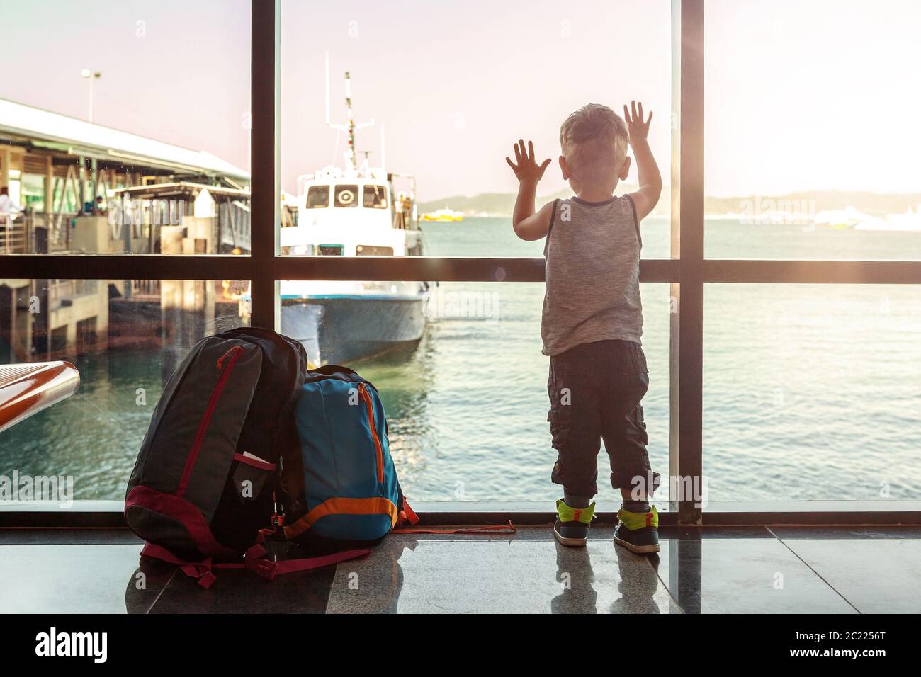 Boy on dock hi-res stock photography and images - Alamy
