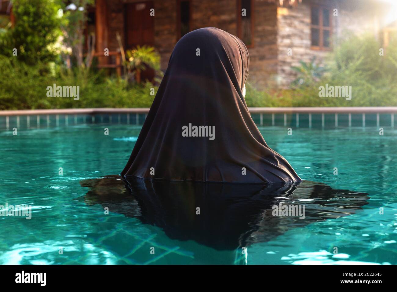 Muslim woman in the water hi-res stock photography and images - Alamy