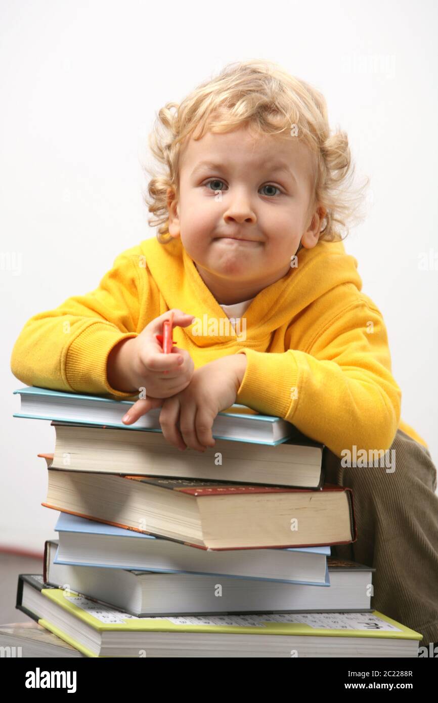 Boy with books Stock Photo - Alamy