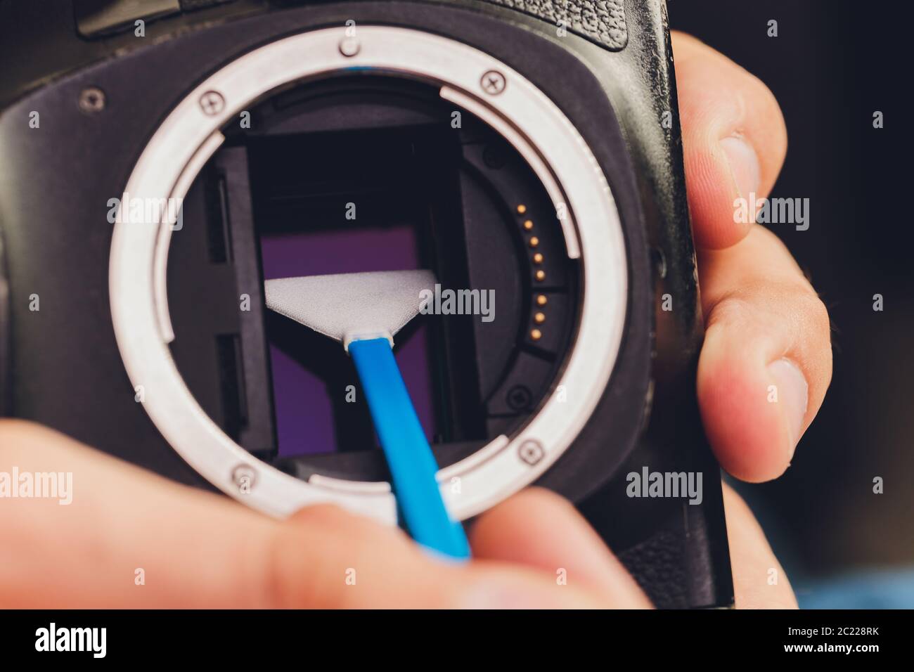 Cleaning dirty camera sensor. Digital photo camera with cleaning tools ...