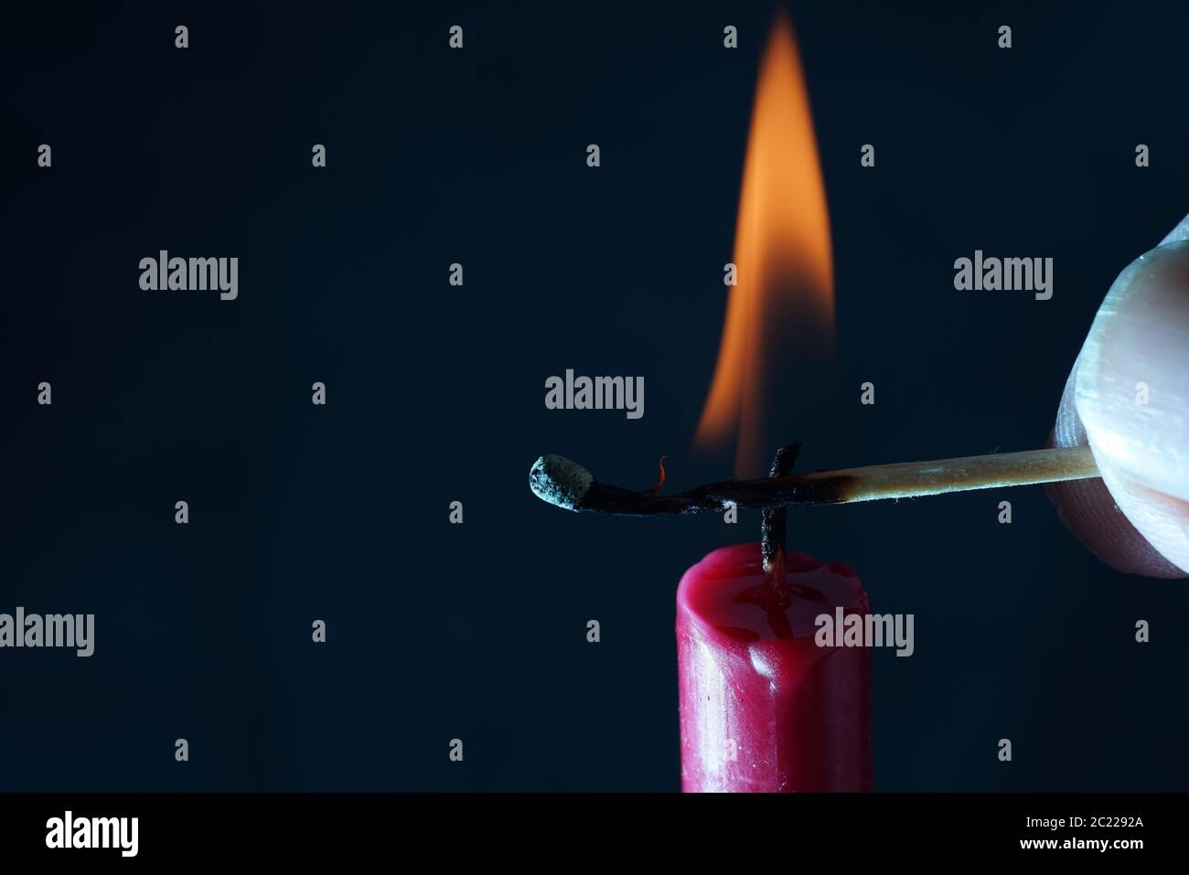 Candle with smoke and flame photographed in the studio with color foils ...