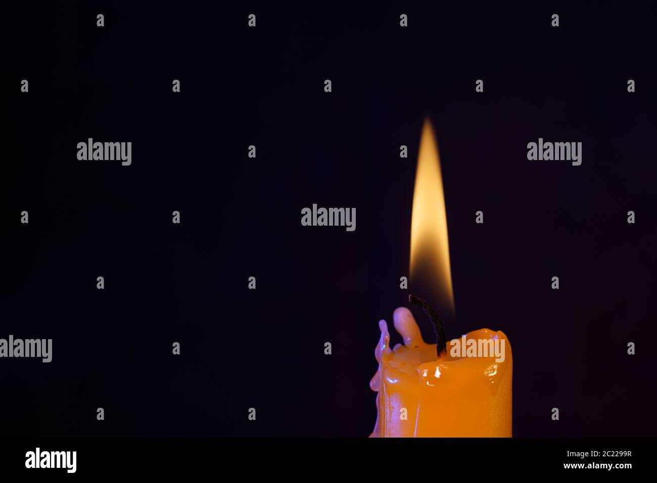 Candle with smoke and flame photographed in the studio with color foils ...