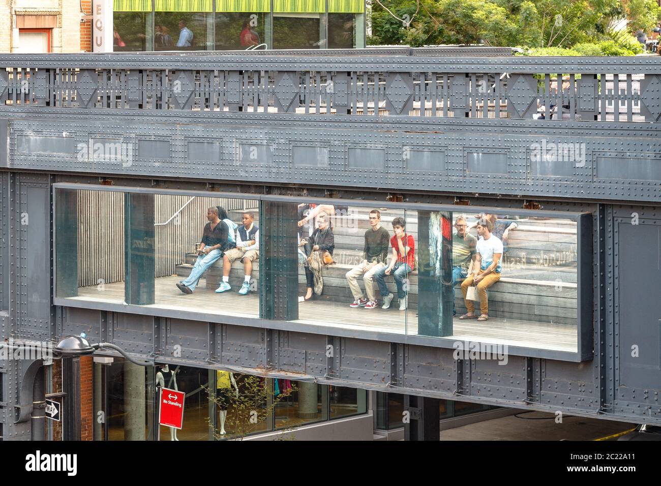 People sitting at the High Line Observation Deck in Manhattan, New York ...