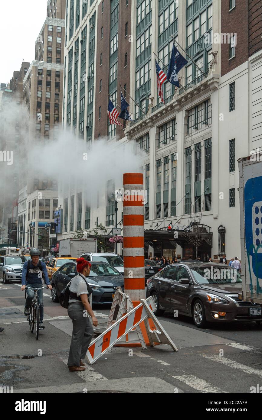 An orange and white stack steam vent belonging to the New York City ...