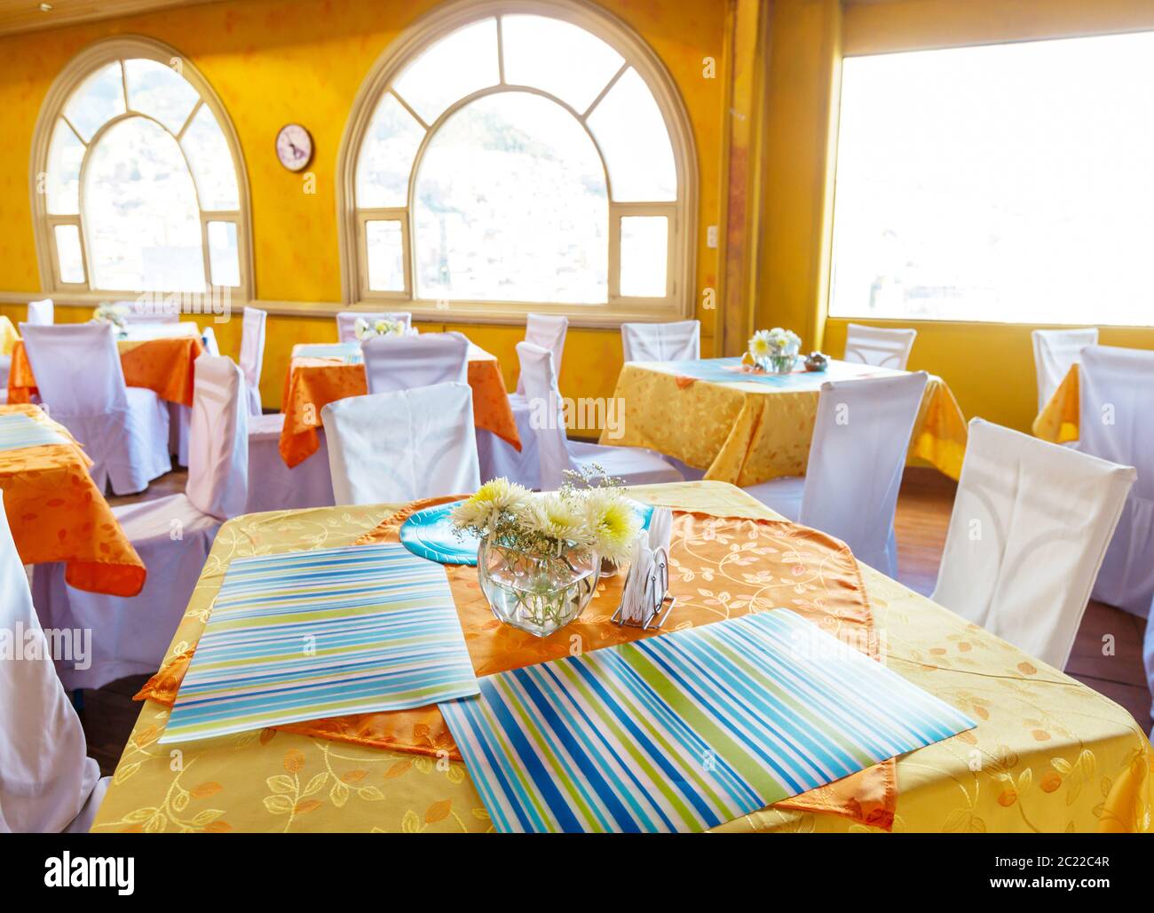 Restaurant interior in yellow and orange design Stock Photo - Alamy