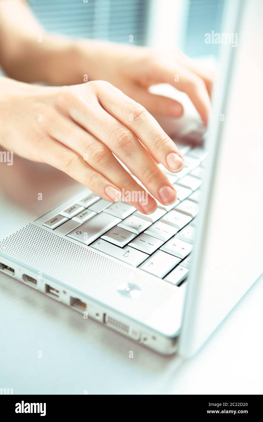 Hands and computer Stock Photo - Alamy