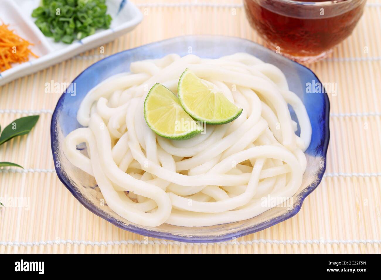 Japanese chilled udon noodles in a glass plate with soy sauce Stock ...