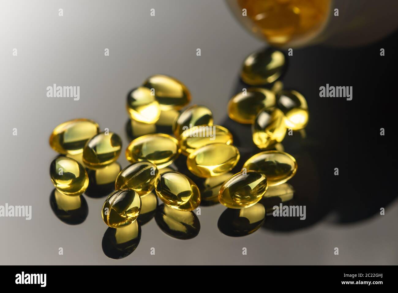 The capsules of the drug are scattered on the table with a close-up ...