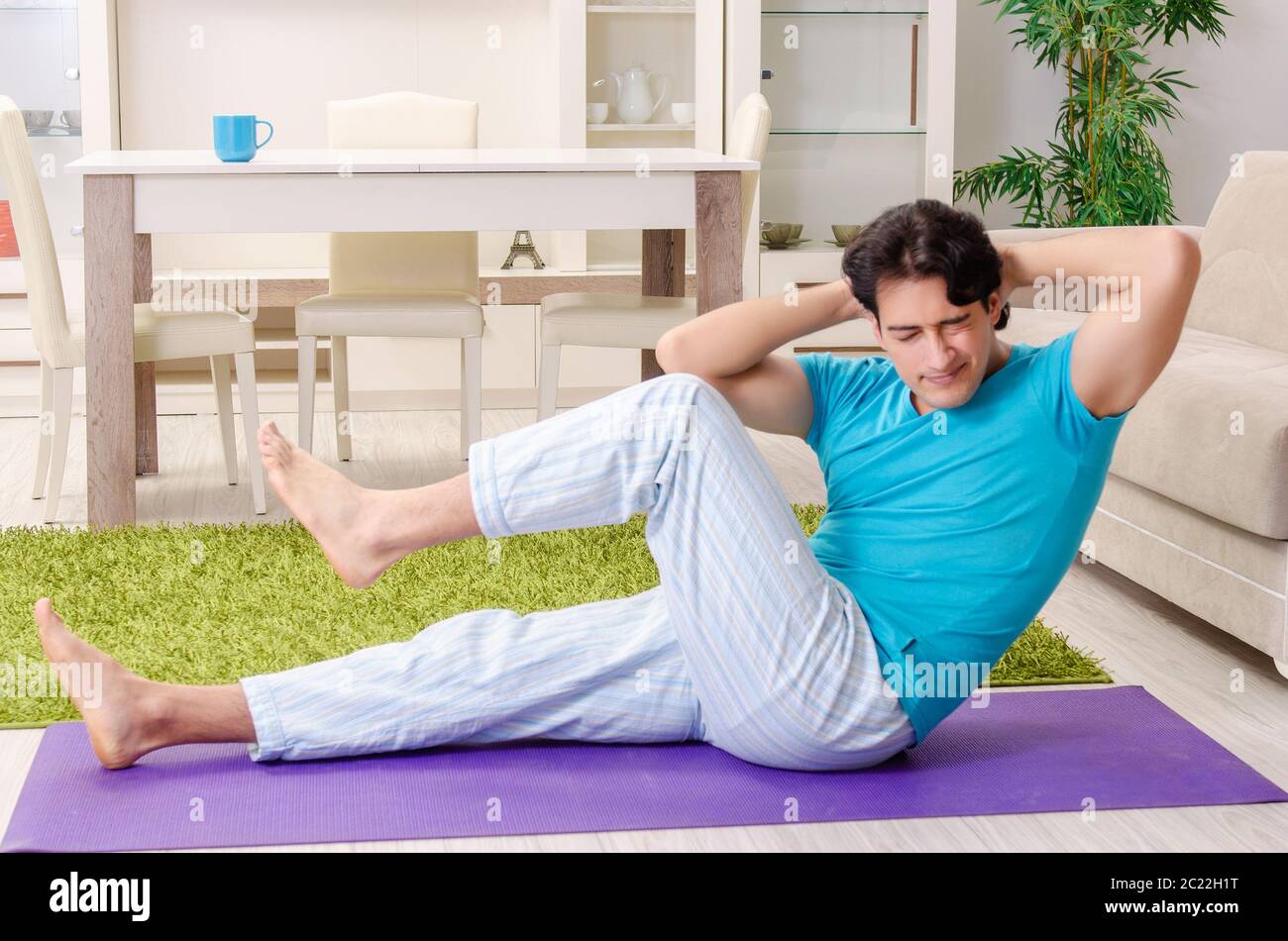 Young handsome man doing morning exercises Stock Photo - Alamy