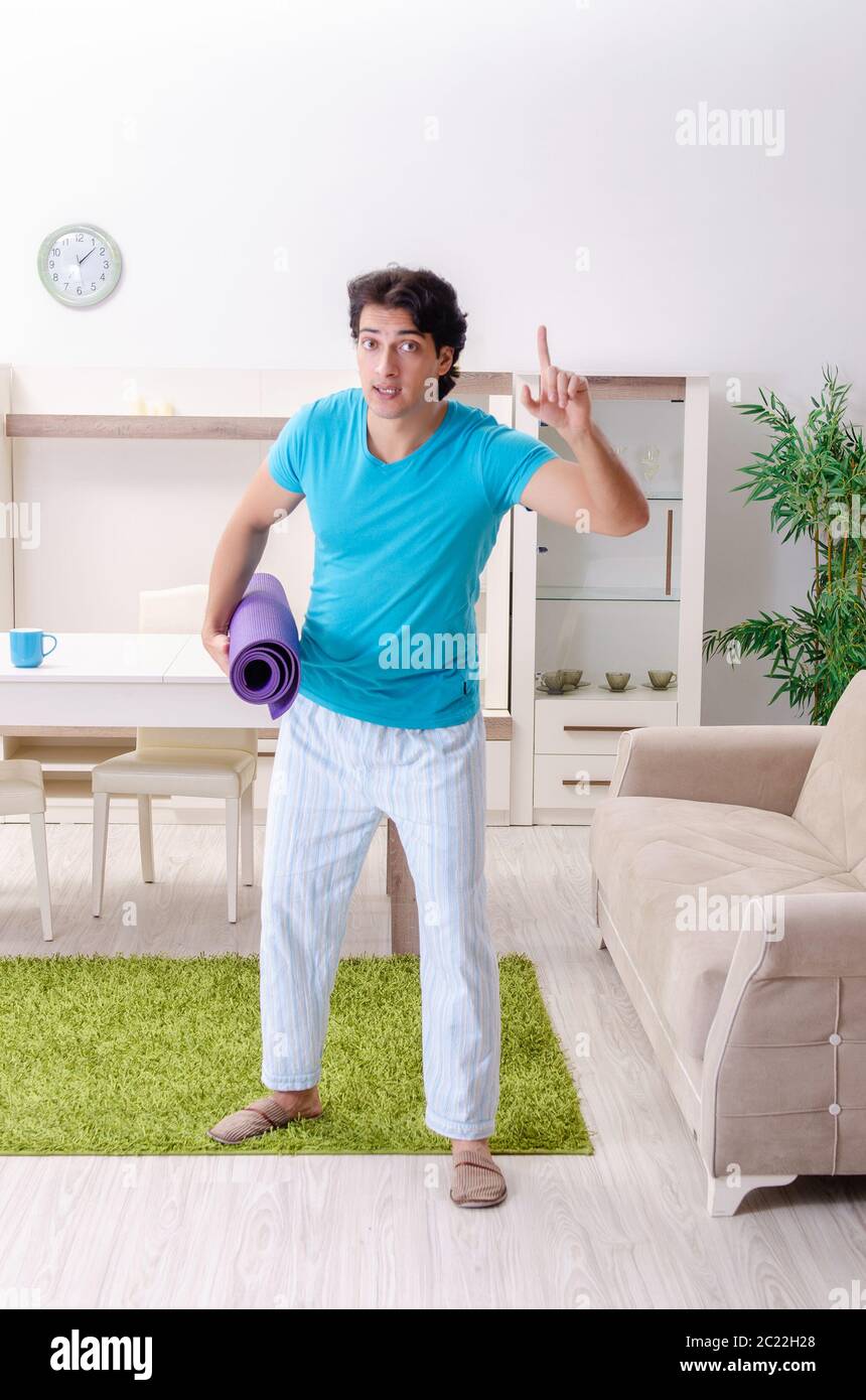 Young handsome man doing morning exercises Stock Photo - Alamy