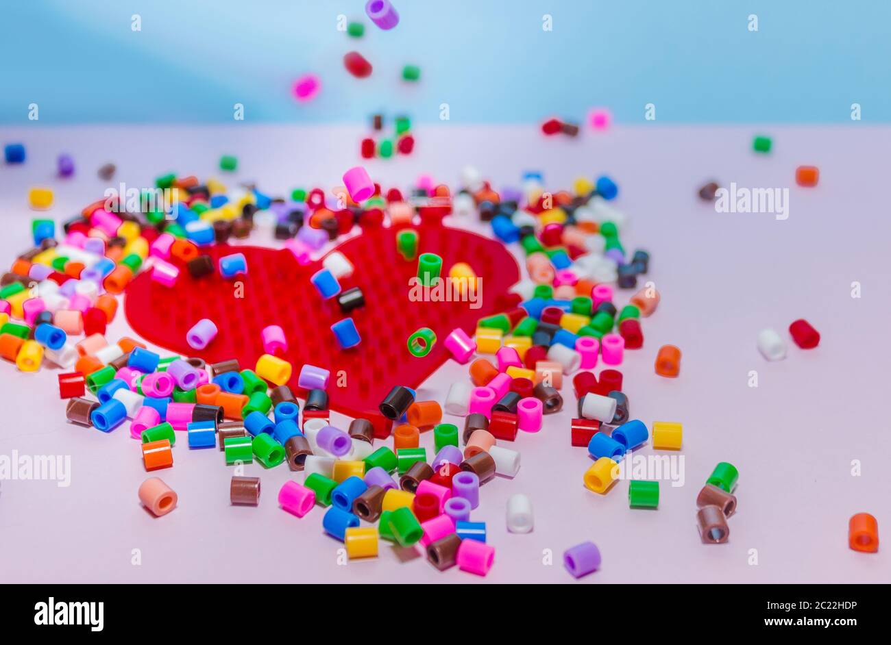 Rain of colors falling on a heart Stock Photo - Alamy