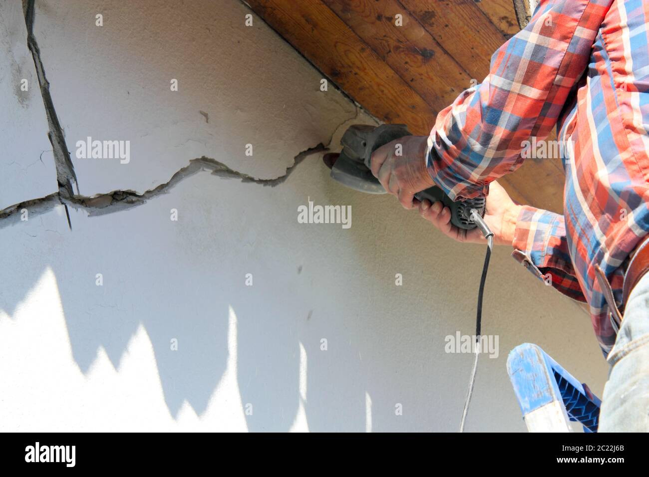 Grinding off the facade Stock Photo - Alamy