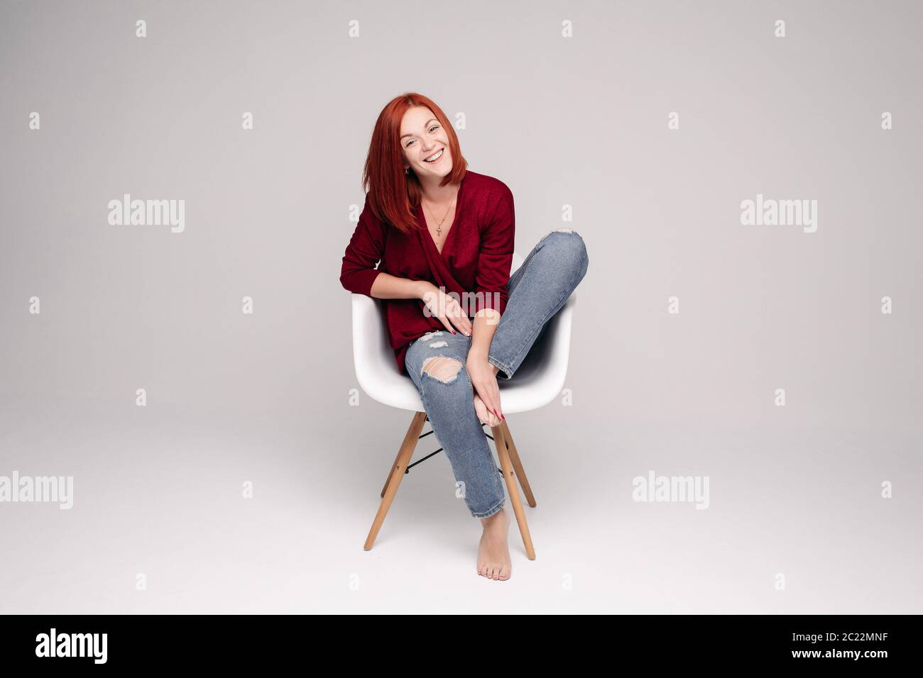 Female model sitting on chair hi-res stock photography and images - Alamy