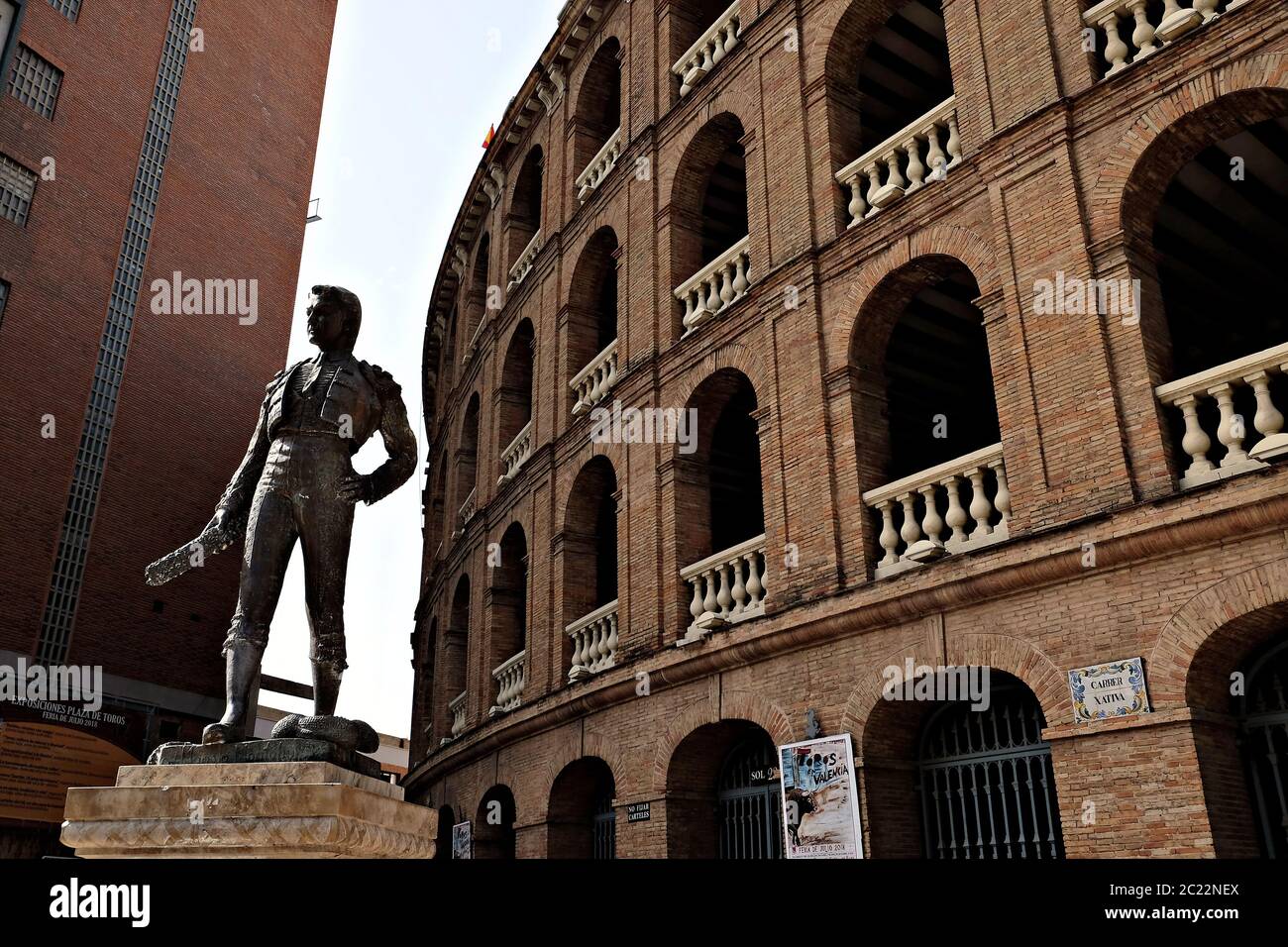 Plaça de Toros exterior view with statue of a valencian matador in ...
